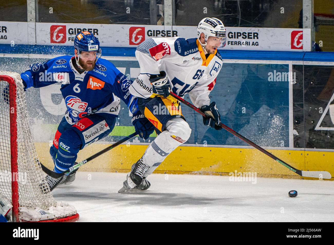 #6 Yannick Weber (ZSC) misses Fabrice Herzog #68 (EV Zug) during the National League Playoff ...