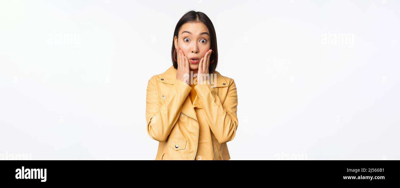 Image of asian woman looking surprised, amazed reaction, shocked face ...