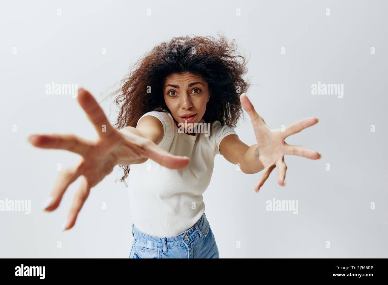 Scared Amazed beautiful attractive curly brunette latin woman 20s in ...