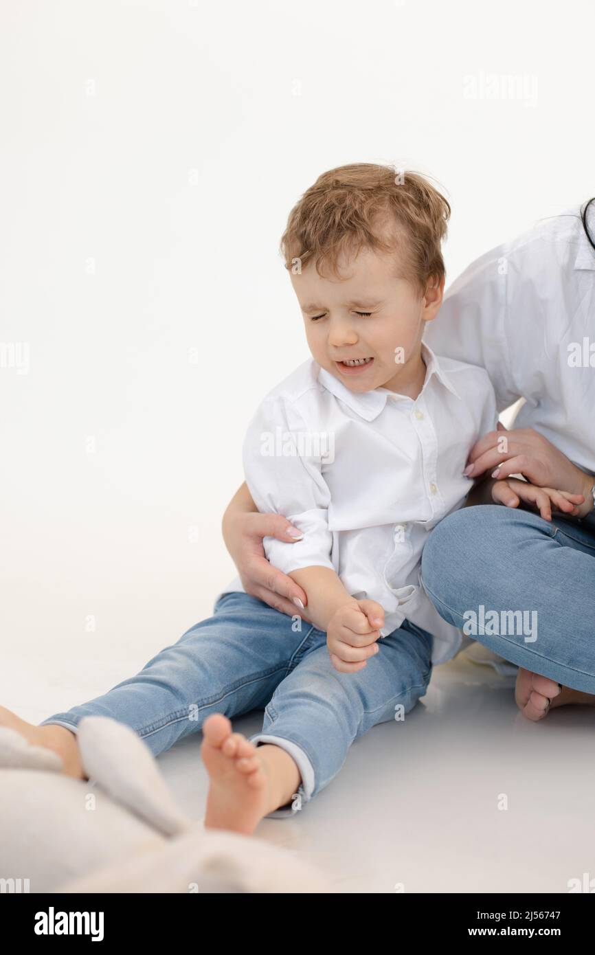 Vertical portrait of sad, crying little kid, boy with close eyes. Bad ...