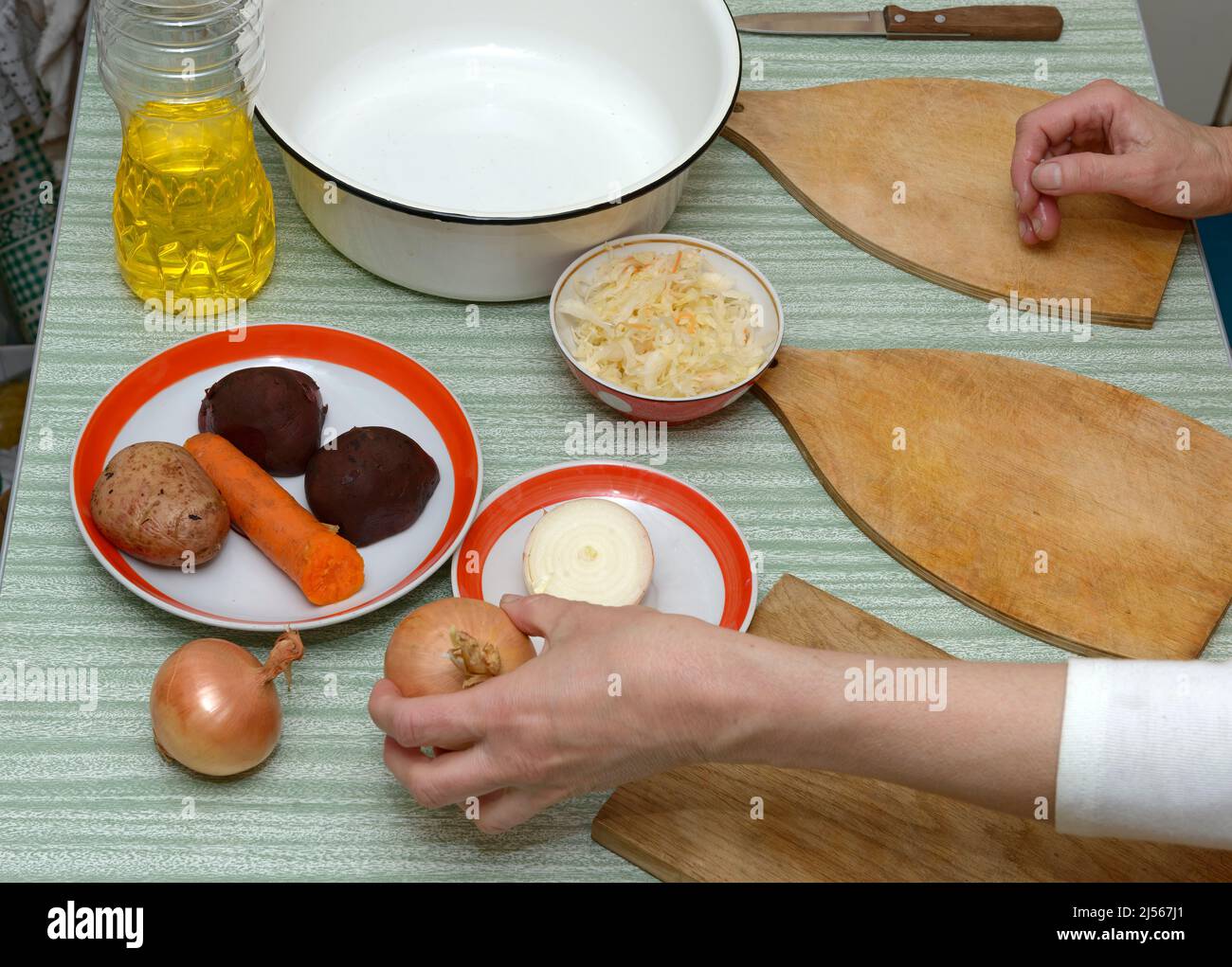 Top of cook table with hand of woman that is putting the bulb yellow ...
