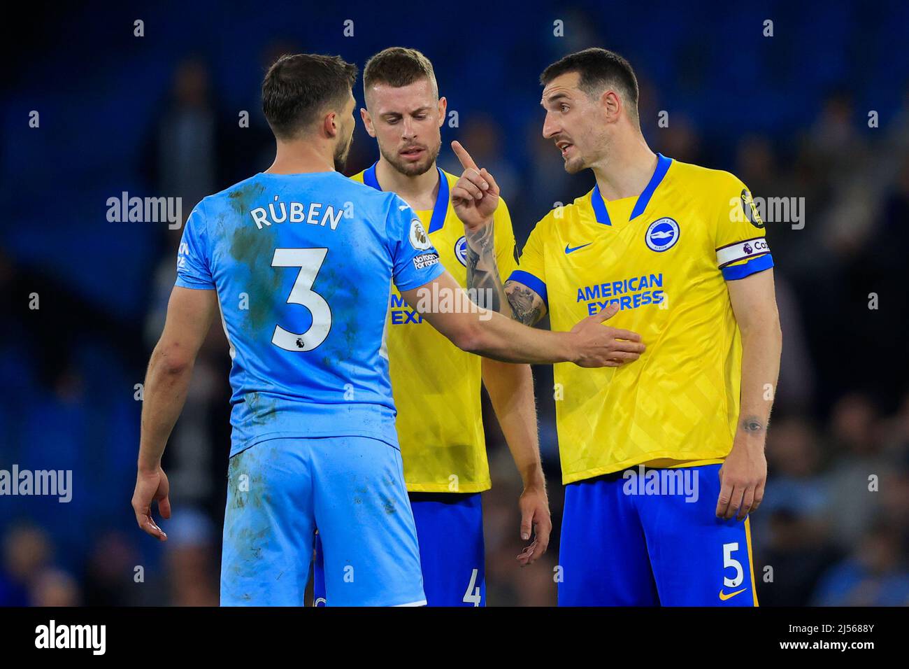 Lewis Dunk #5 of Brighton & Hove Albion and Ruben Dias #3 of Manchester ...