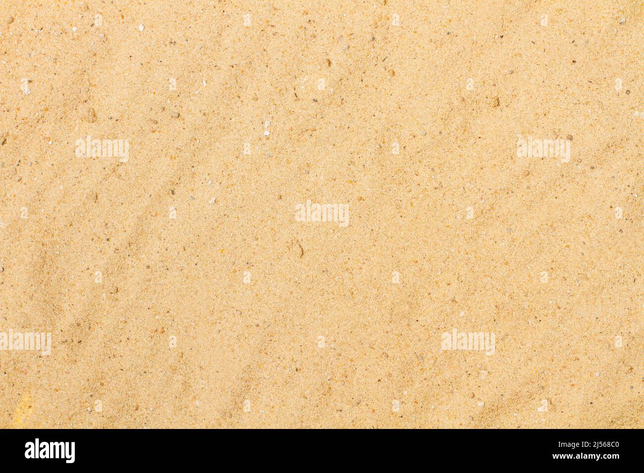 Yellow sand background in a close up view Stock Photo - Alamy