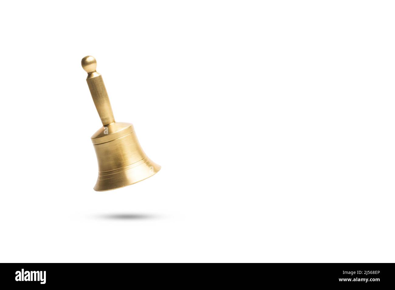 A bronze bell floating on a white background with copy space Stock ...