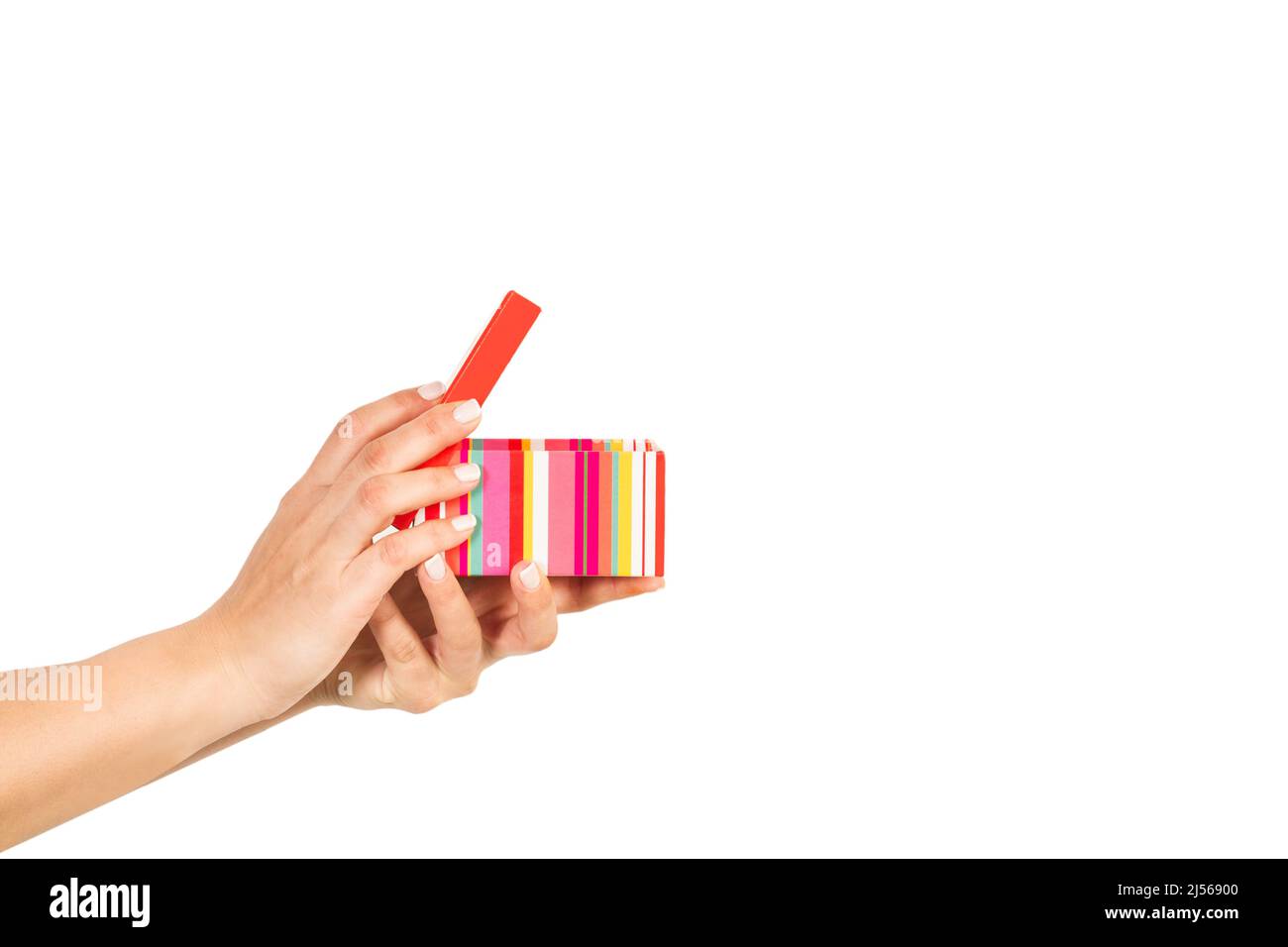Woman hand holding an open colored box on a white background with copy ...