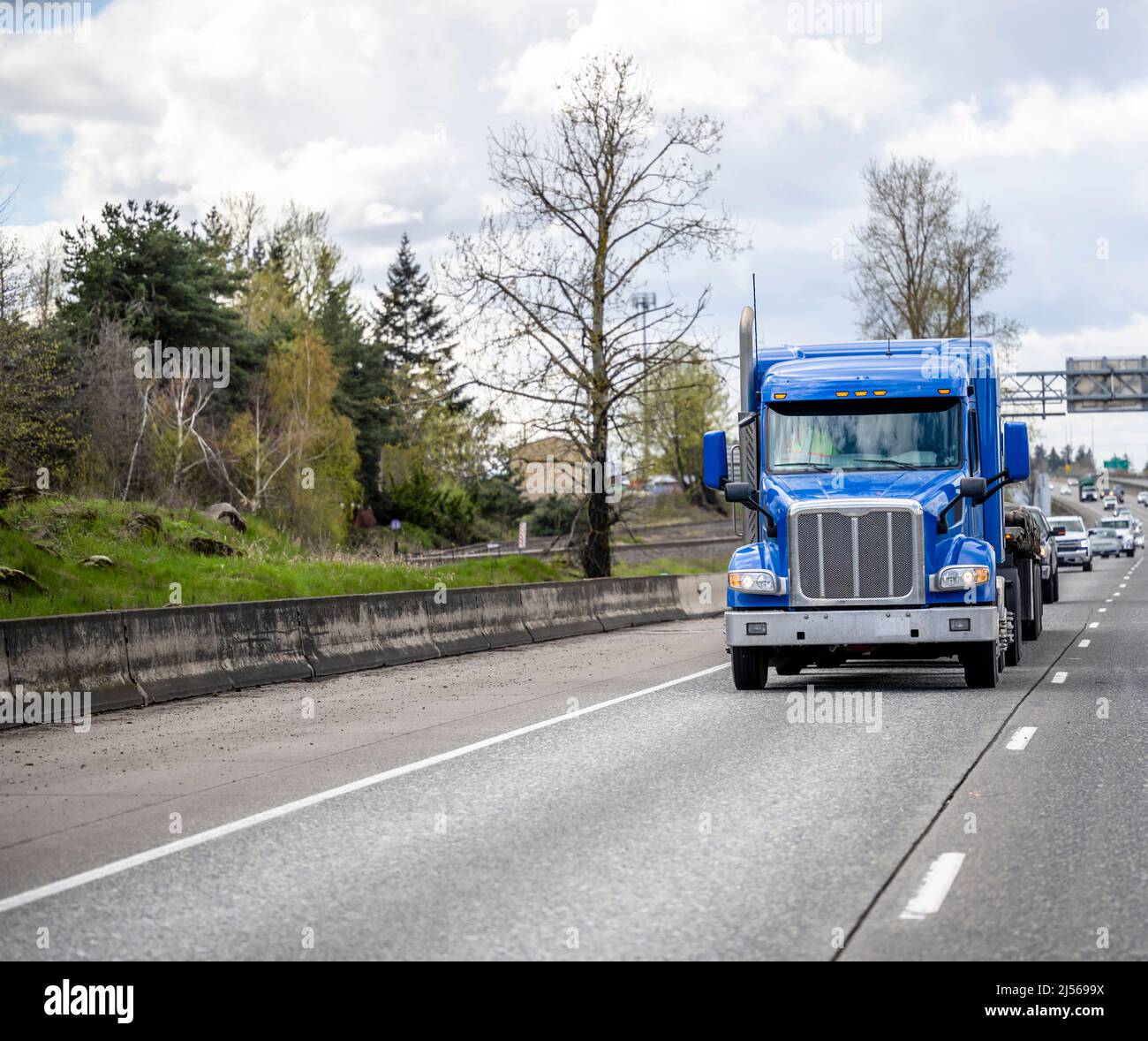 Industrial standard blue low profile cab loaded big rig semi truck with ...