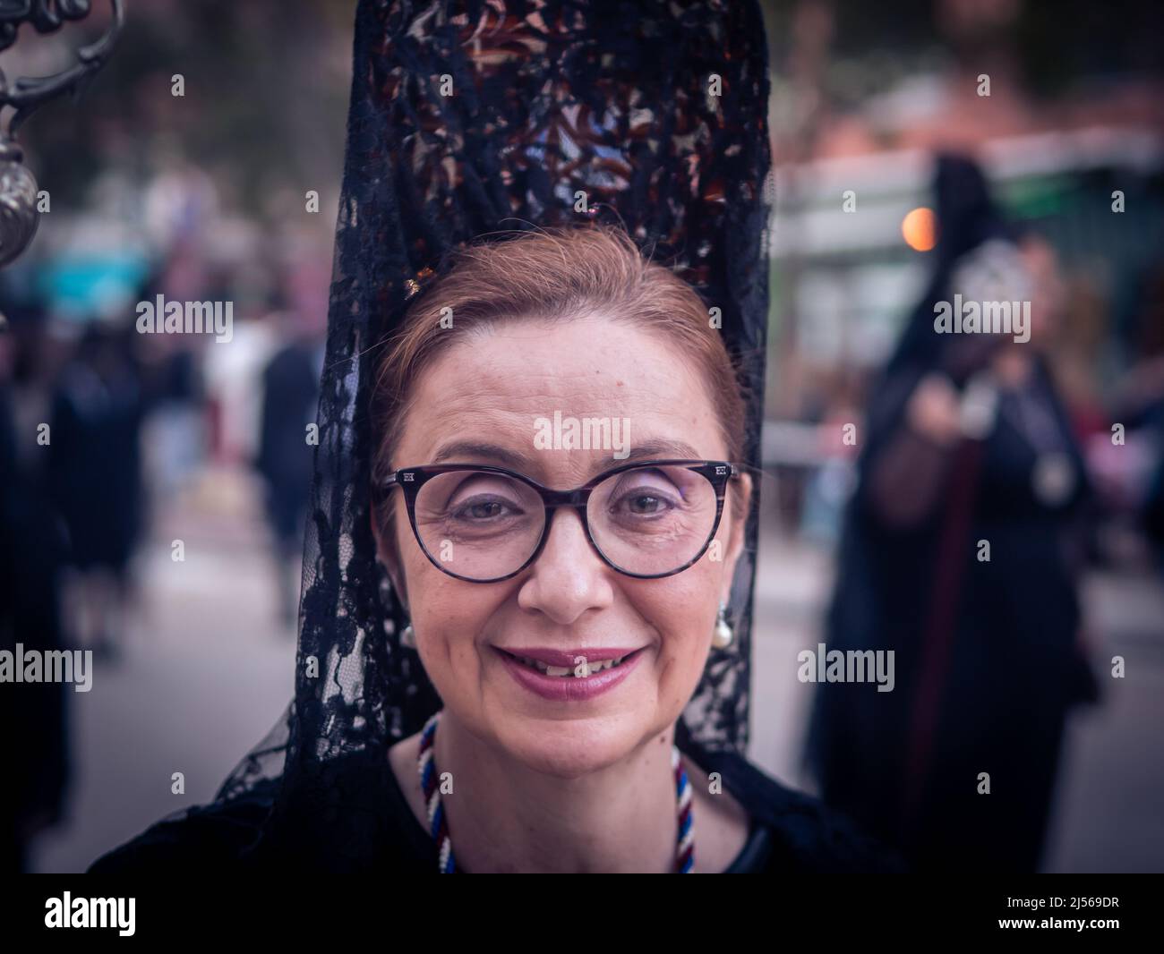 Woman Carries The Traditional Spanish Head Coverage Called Mantilla ...