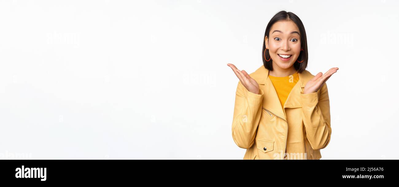 Image of asian woman looking surprised, amazed reaction, shocked face ...