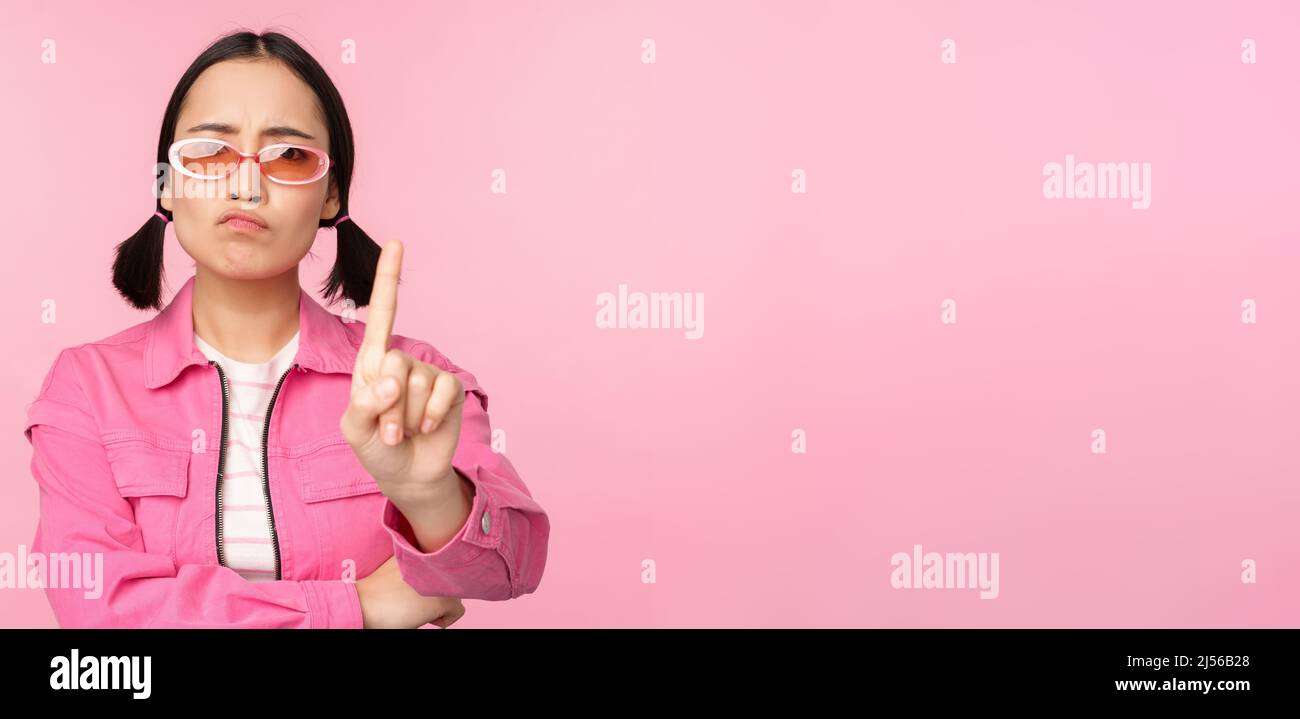 Image Of Serious Stylish Asian Girl In Sunglasses Showing Stop Prohibit Gesture Taboo Sign