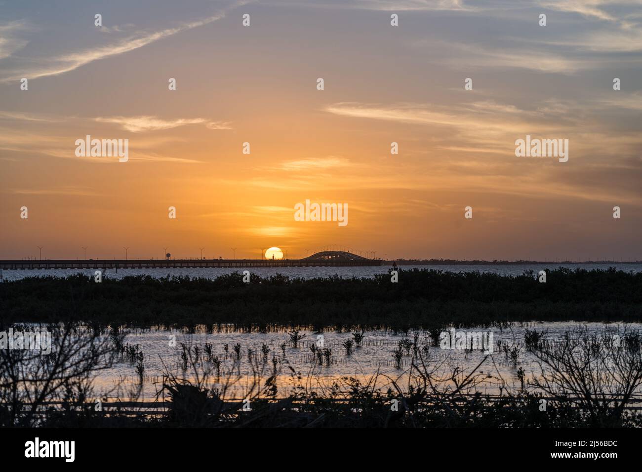 The Port Isabel Lighthouse in front of the setting sun with the Queen ...