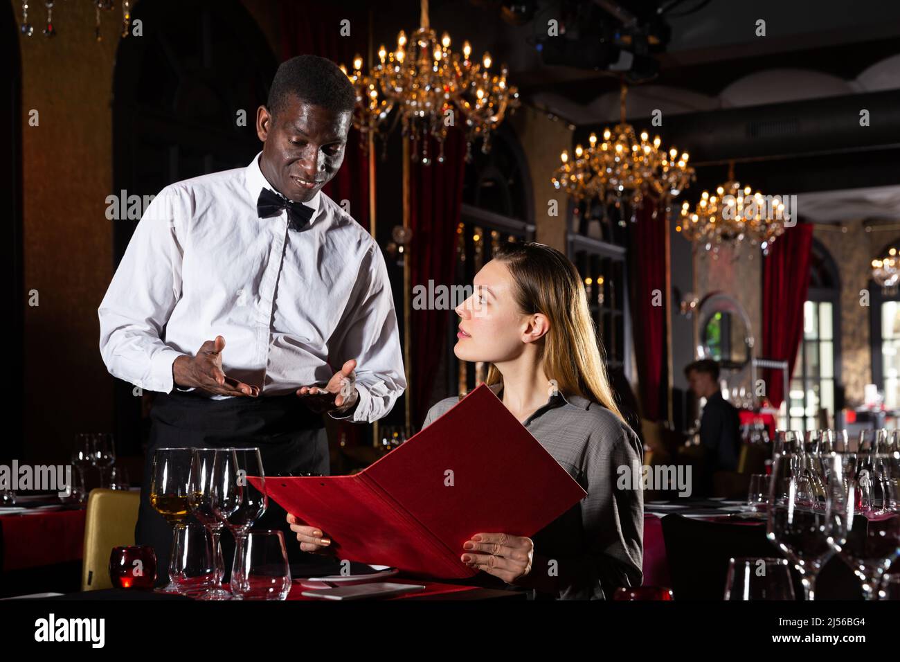 Girl with menu restaurant Stock Photo - Alamy