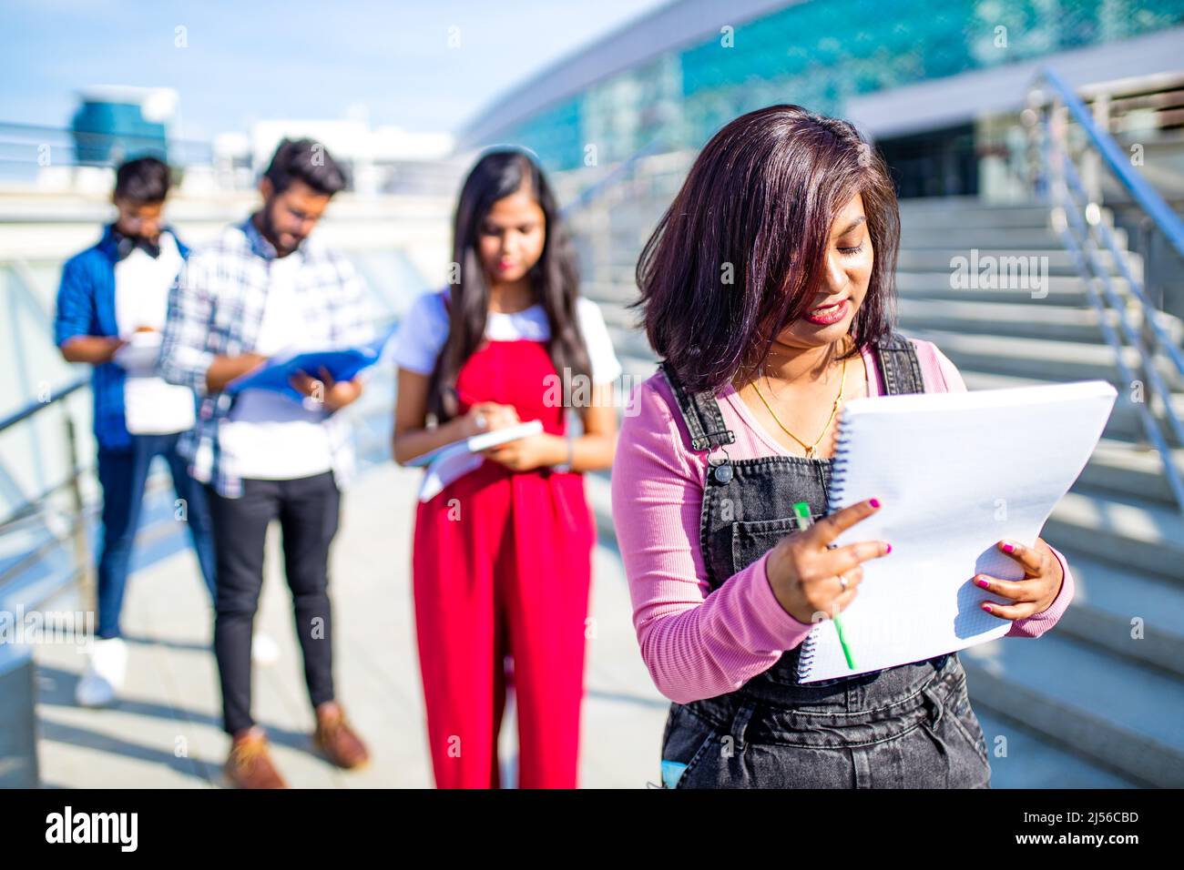 indian students keeping distance and do home work outdoors Stock Photo ...