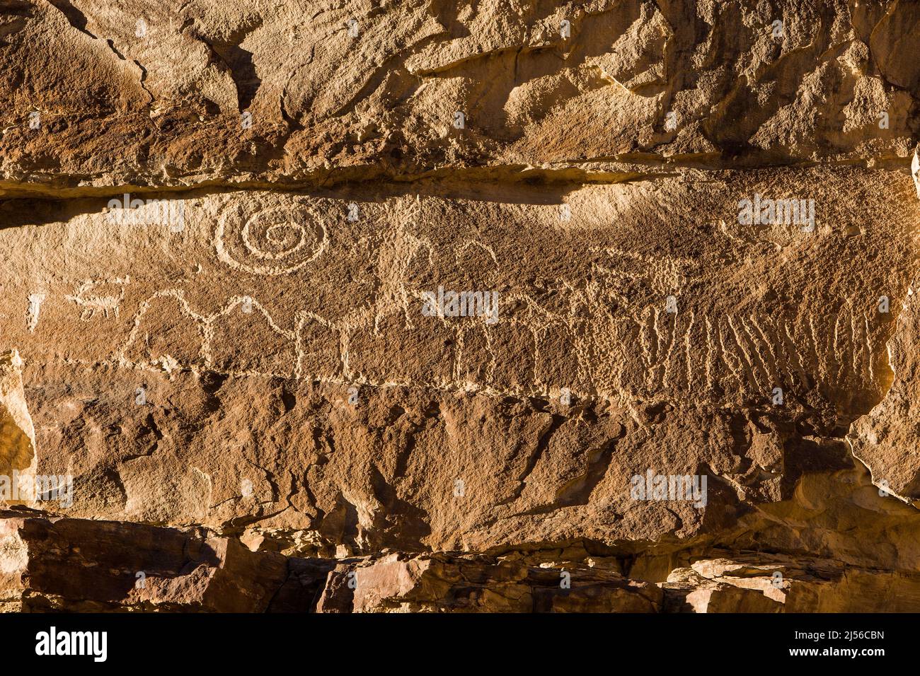 A Fremont-style petroglyph panel with spirals, wavy lines and an ...