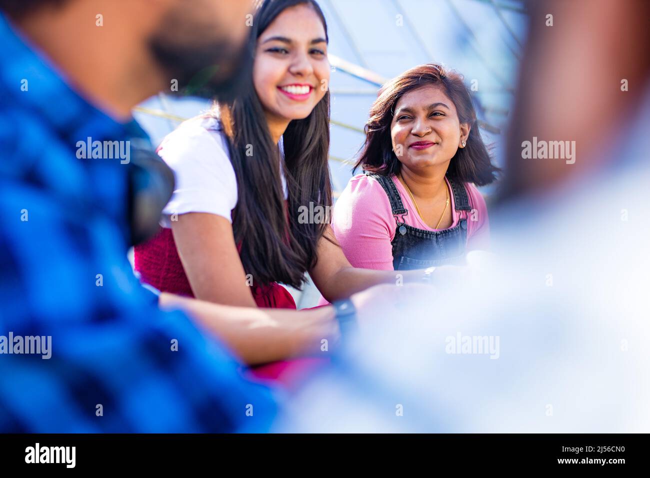 infian best friends spending time together outdoors in spring park ...