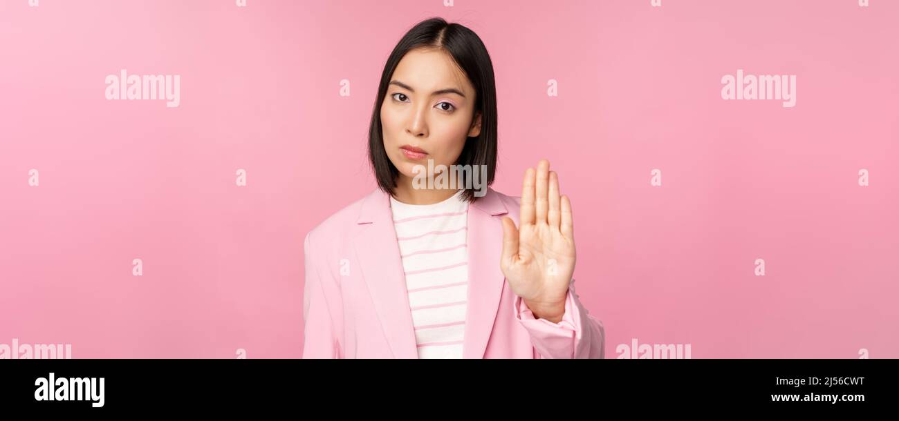 Asian businesswoman with serious, concerned face expression, showing ...