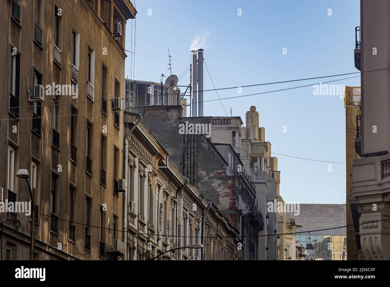 Bucharest, Romania - January 05, 2022: Smoke chimneys are seen on a ...