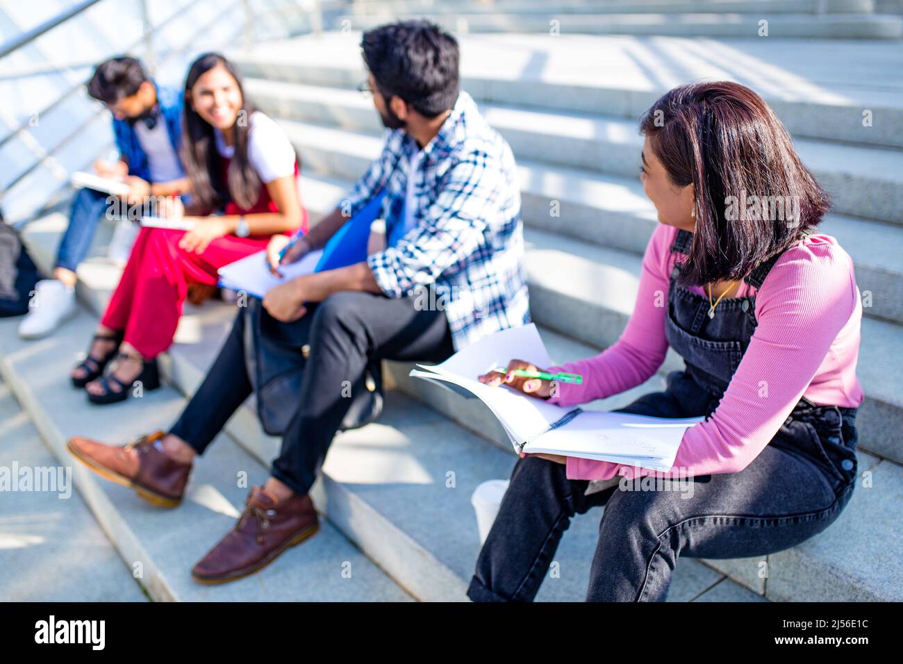 indian students keeping distance and do home work outdoors Stock Photo ...