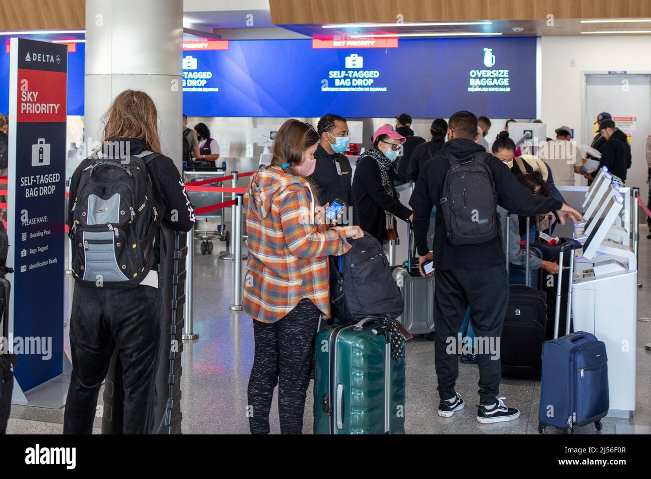 Los Angeles, CA April 20th: Customers use the self check-in inside the ...