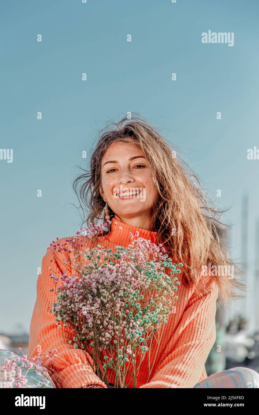 Happy woman smelling bouquet hi-res stock photography and images - Alamy