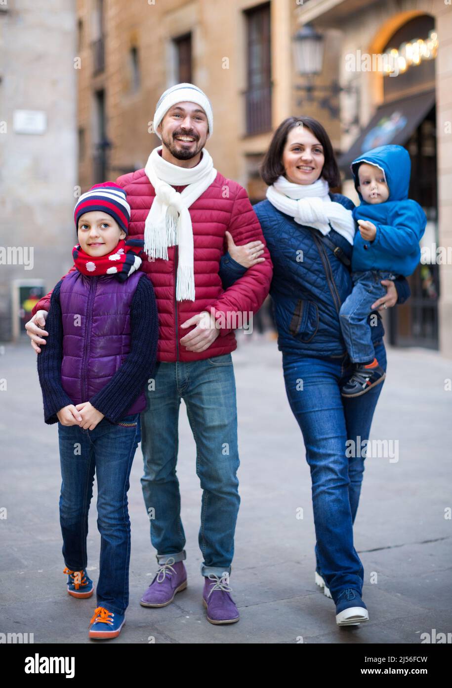 Positive family walking Stock Photo - Alamy