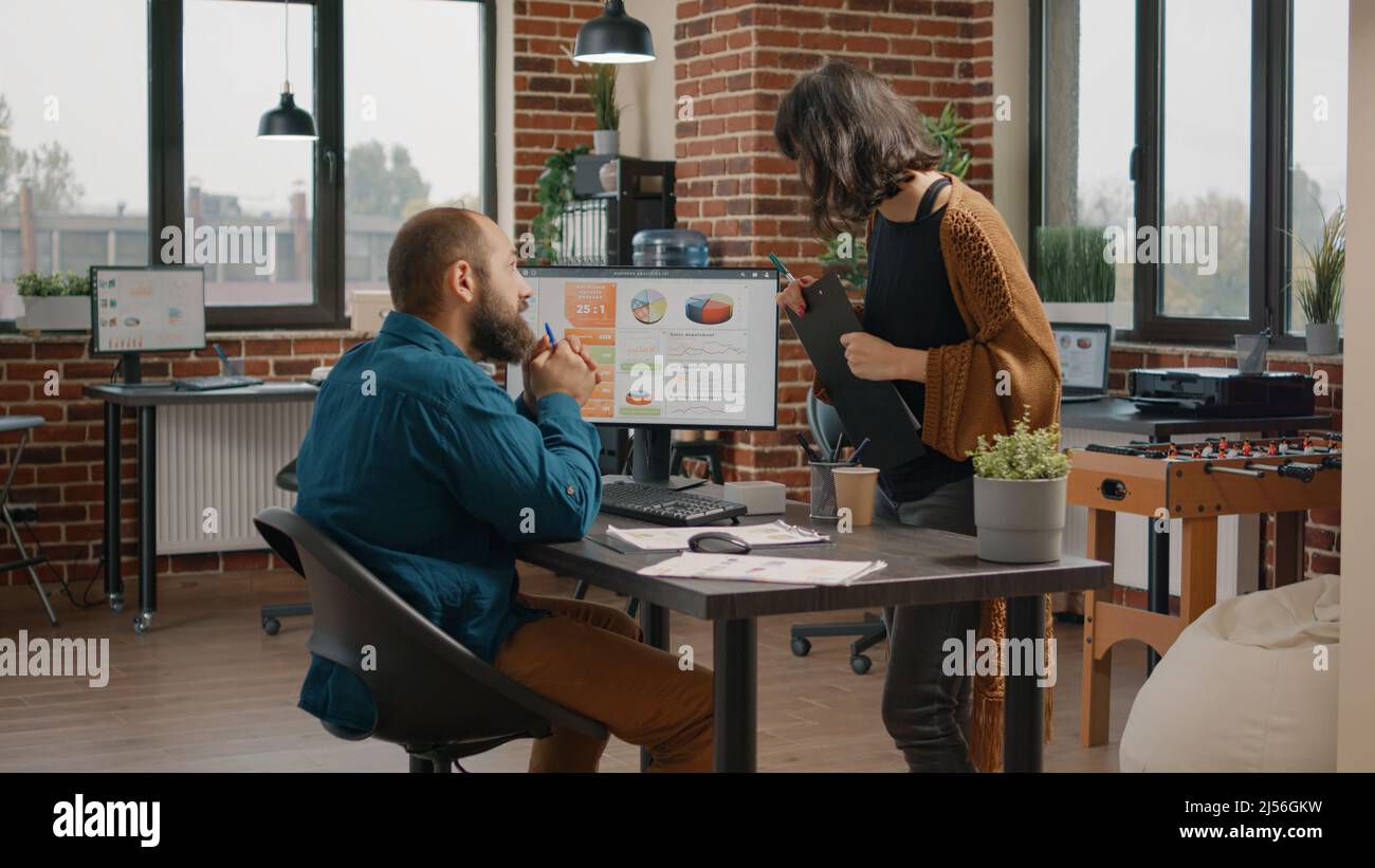 Man employee asking colleague help hi-res stock photography and images ...
