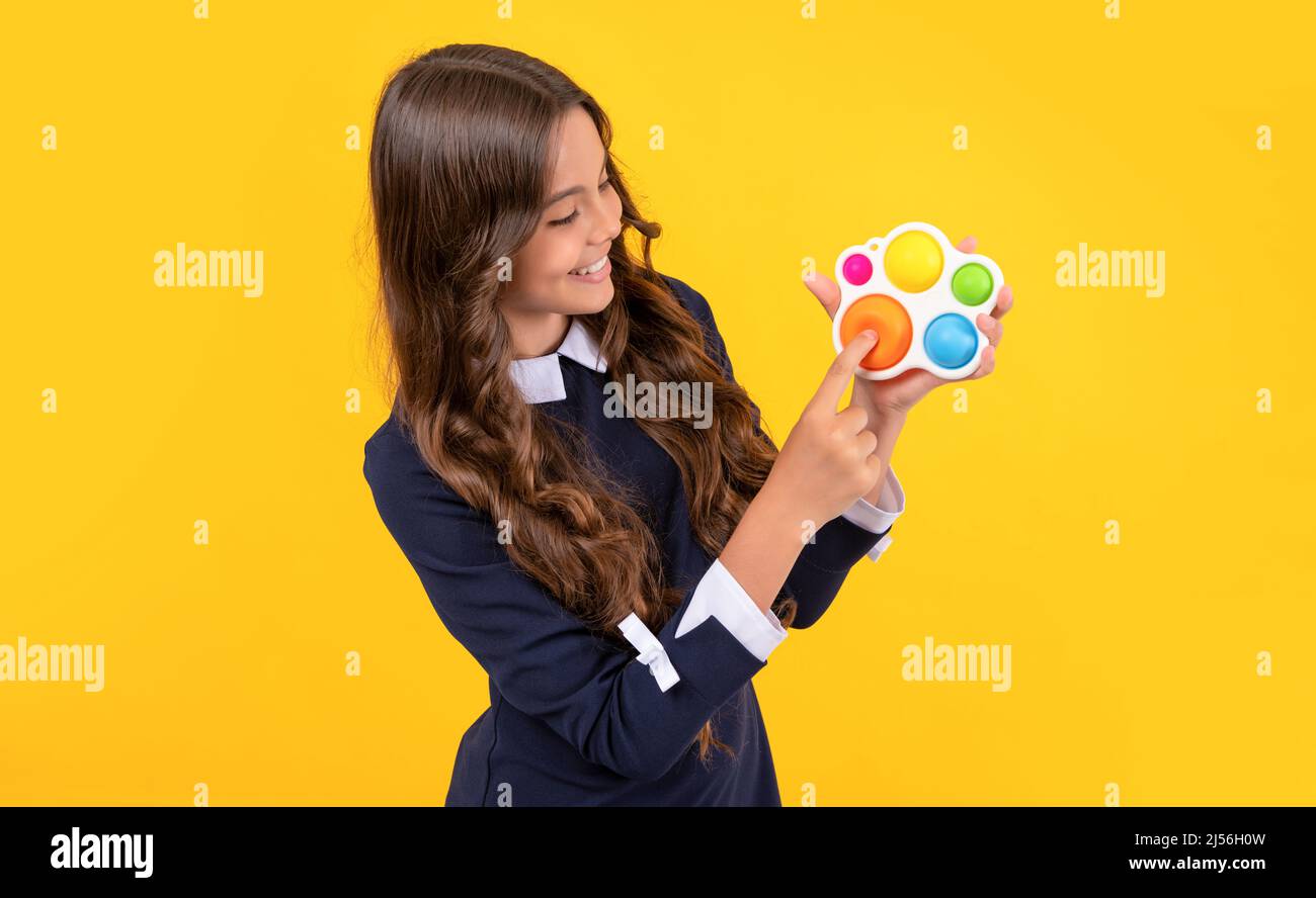 girl with finger game. kid popping anti stress bubble. motor skills ...