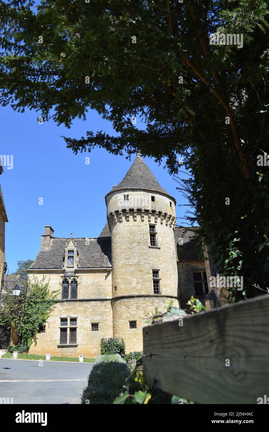 Old style castle like building seen in a village of the Dordogne ...