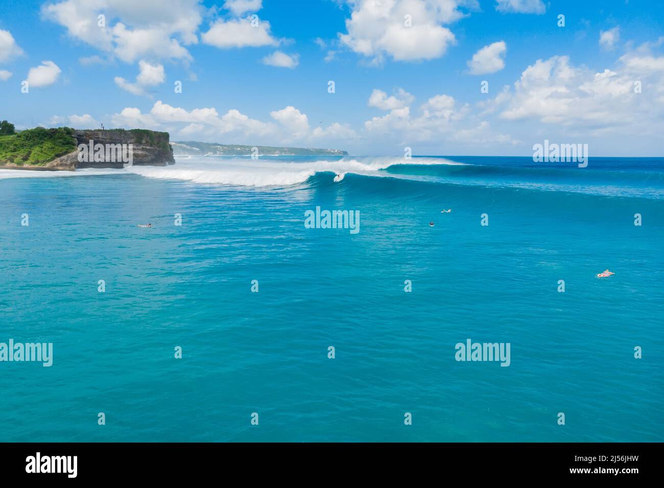 Aerial view of big blue wave and surfing in Bali. Balangan beach Stock ...