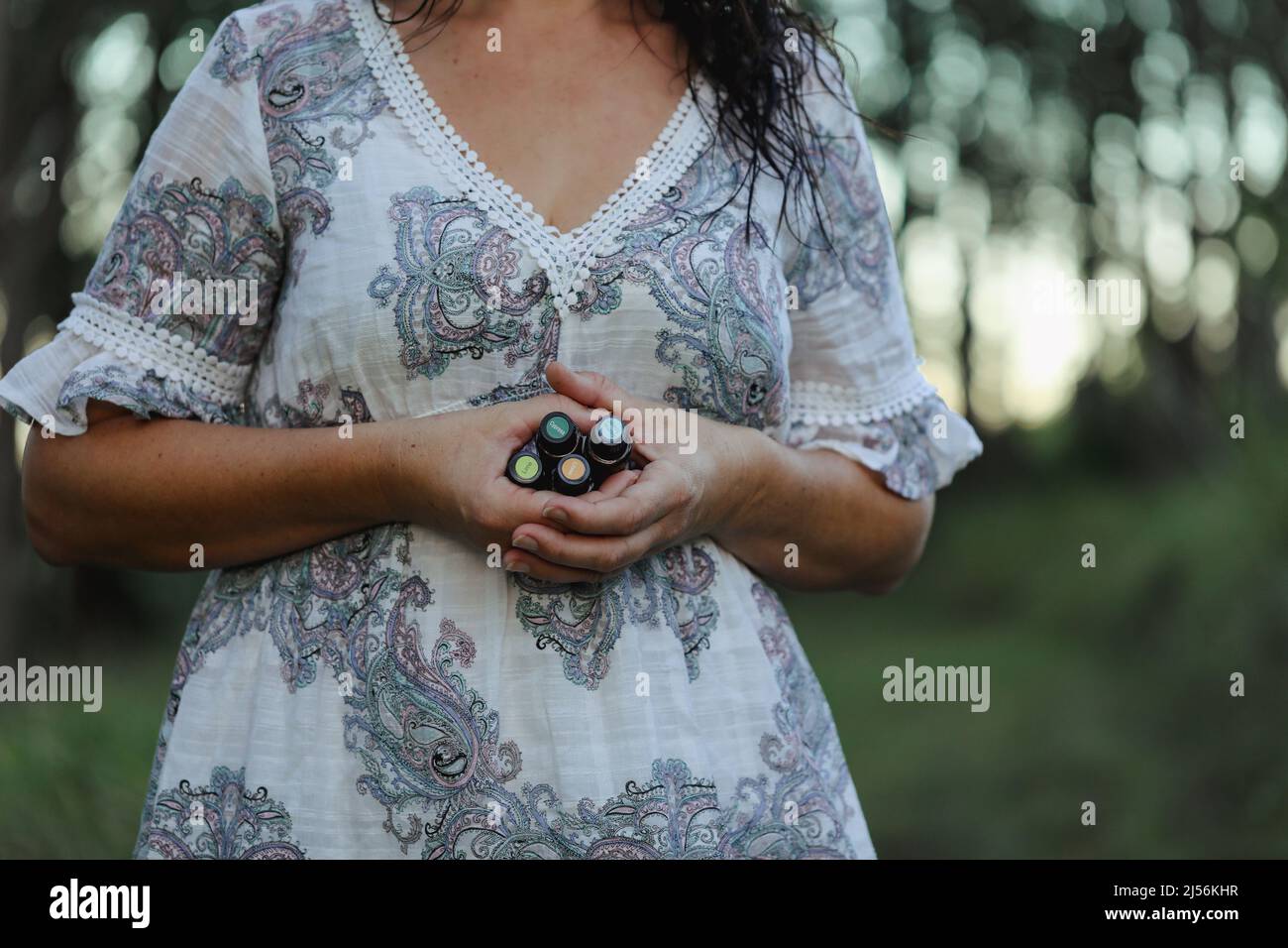 Firefly NSW Australia - 20 April 2022: Woman in forest holding bundle ...