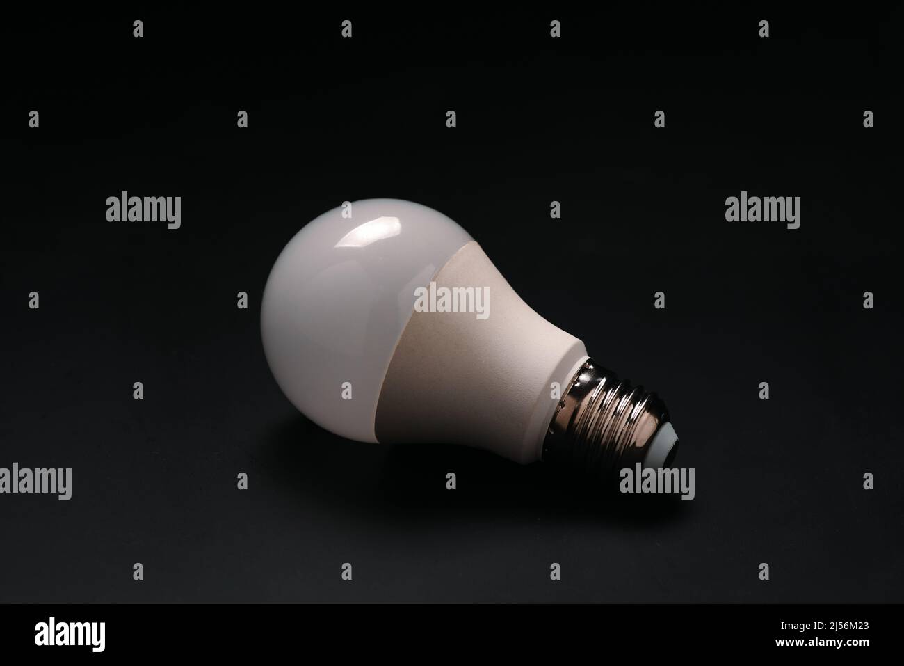 light bulb on black background Stock Photo - Alamy