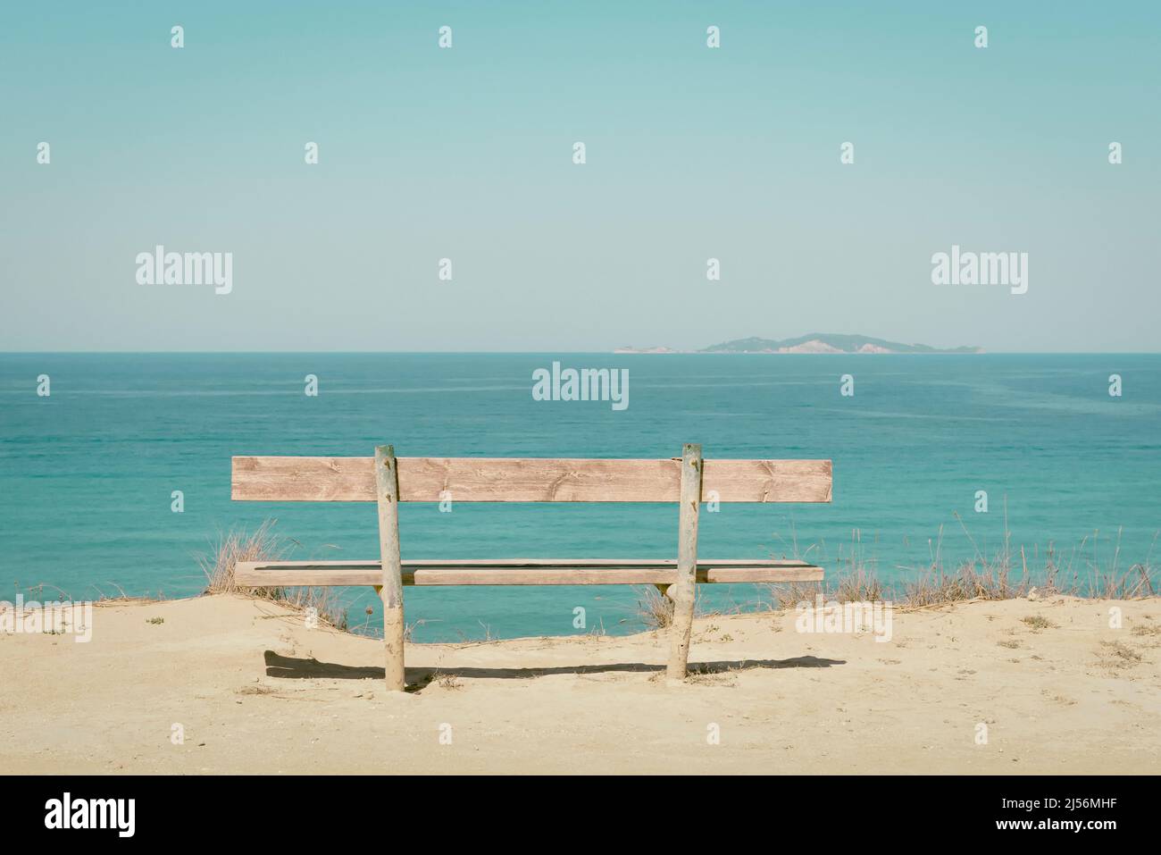 Rustic bench facing the sea Stock Photo - Alamy