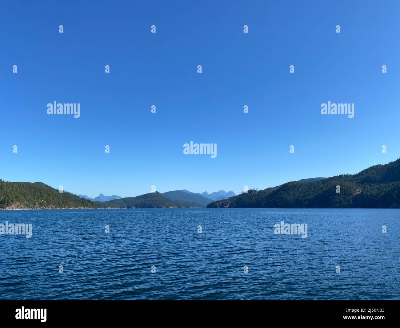 Entrance to Jervis Inlet with Coast Mountains and temperate rainforest ...