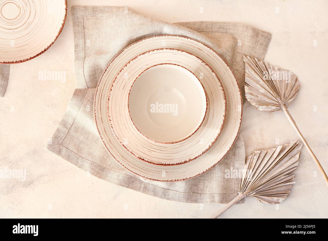 Elegant table setting on light background Stock Photo - Alamy