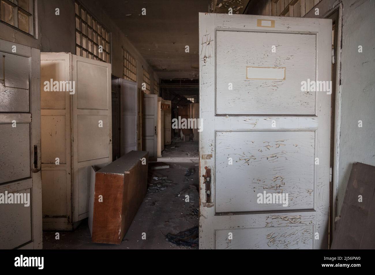 Picture of a damaged interior of an abandoned office building with a ...