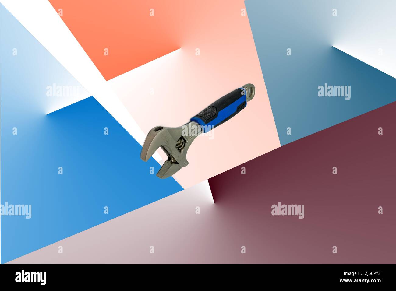 Wrench in a polygon colorful geometric space Stock Photo - Alamy