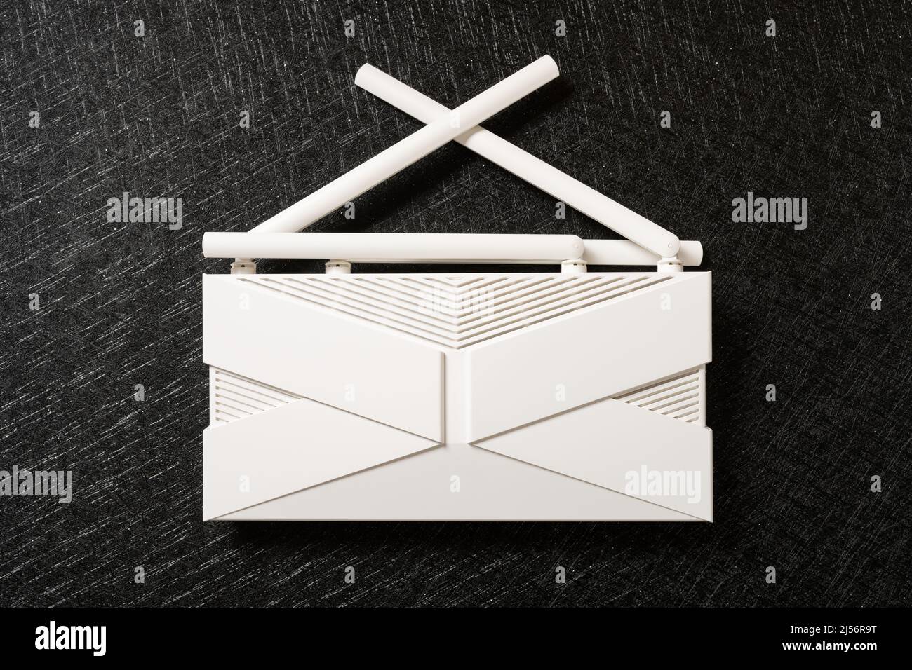 top view white wifi router on a black background Stock Photo - Alamy
