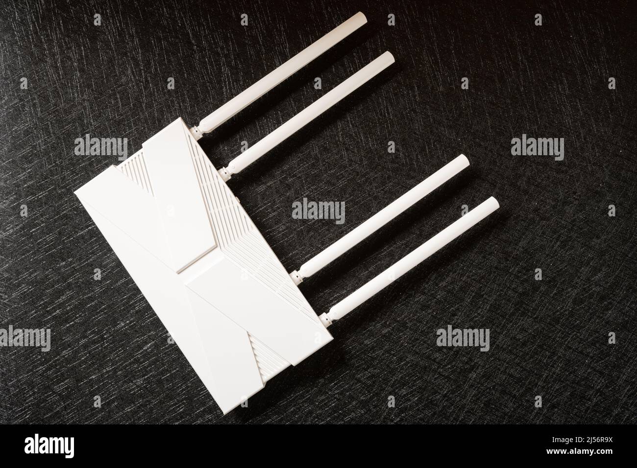 top view white wifi router on a black background Stock Photo - Alamy