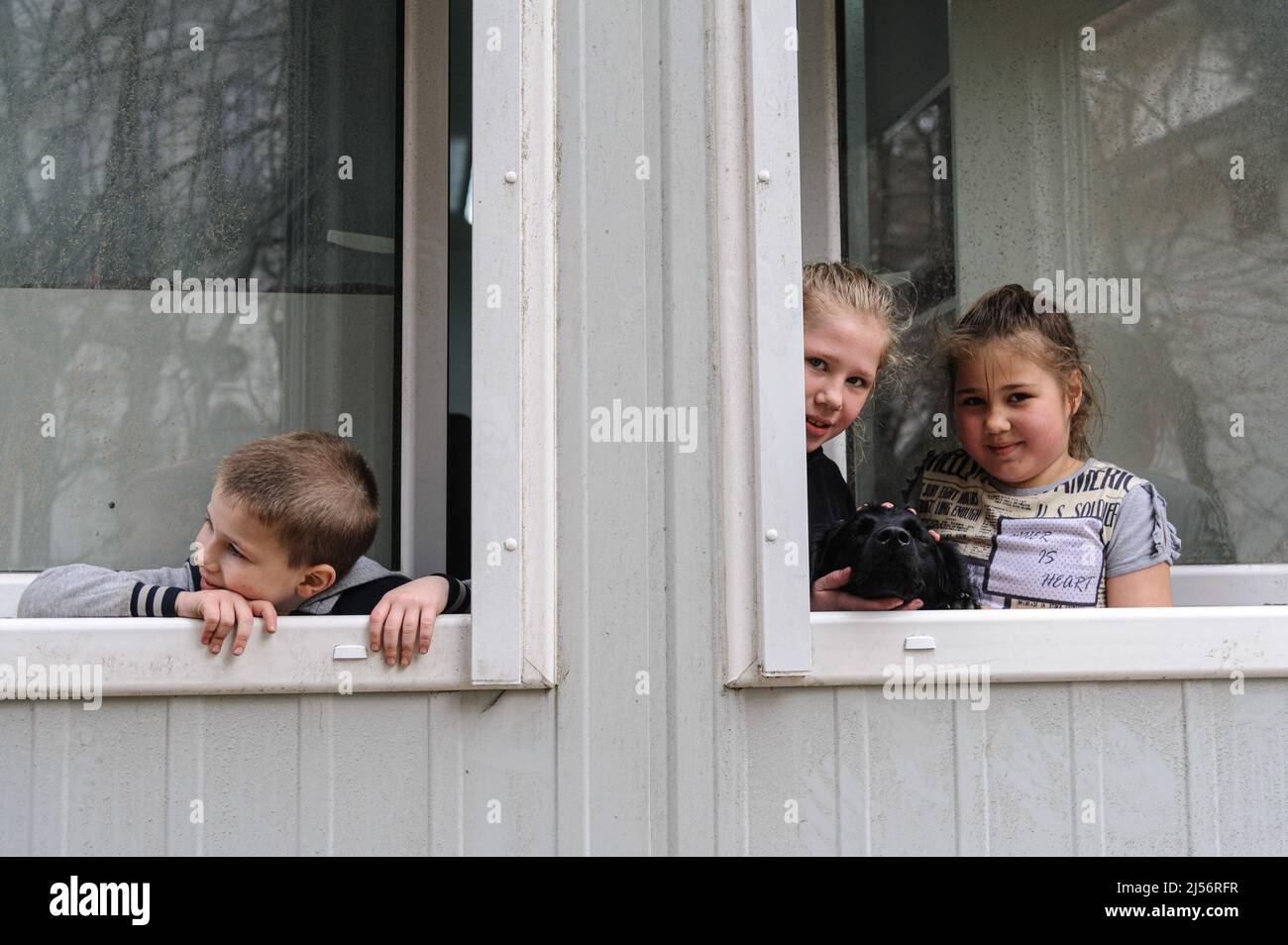 Lviv, Ukraine. 20th Apr, 2022. Ukrainian children seen looking outside ...