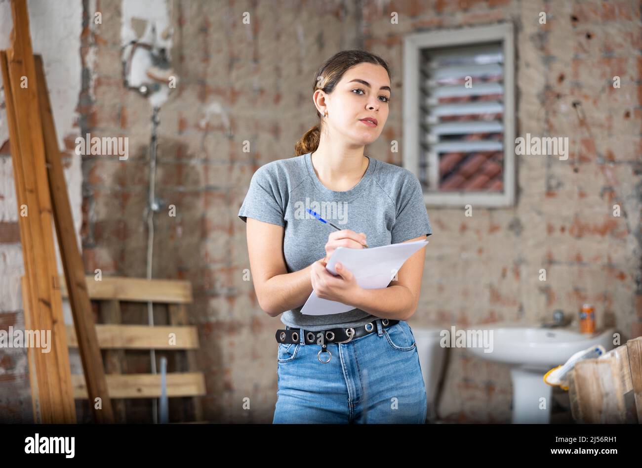 Woman inspecting construction site checking hi-res stock photography ...