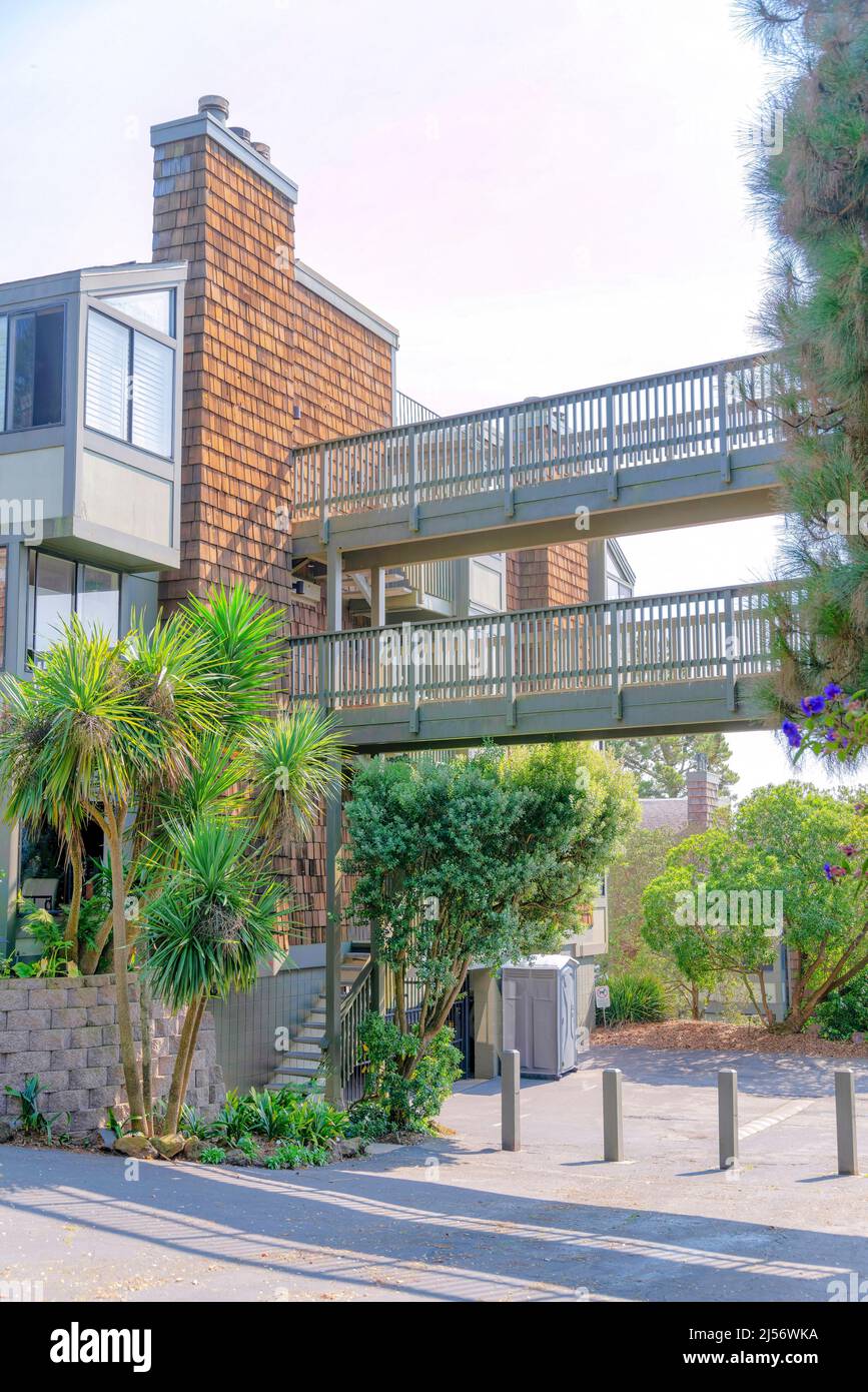 Two footbridges with gray railings between the buildings at San ...
