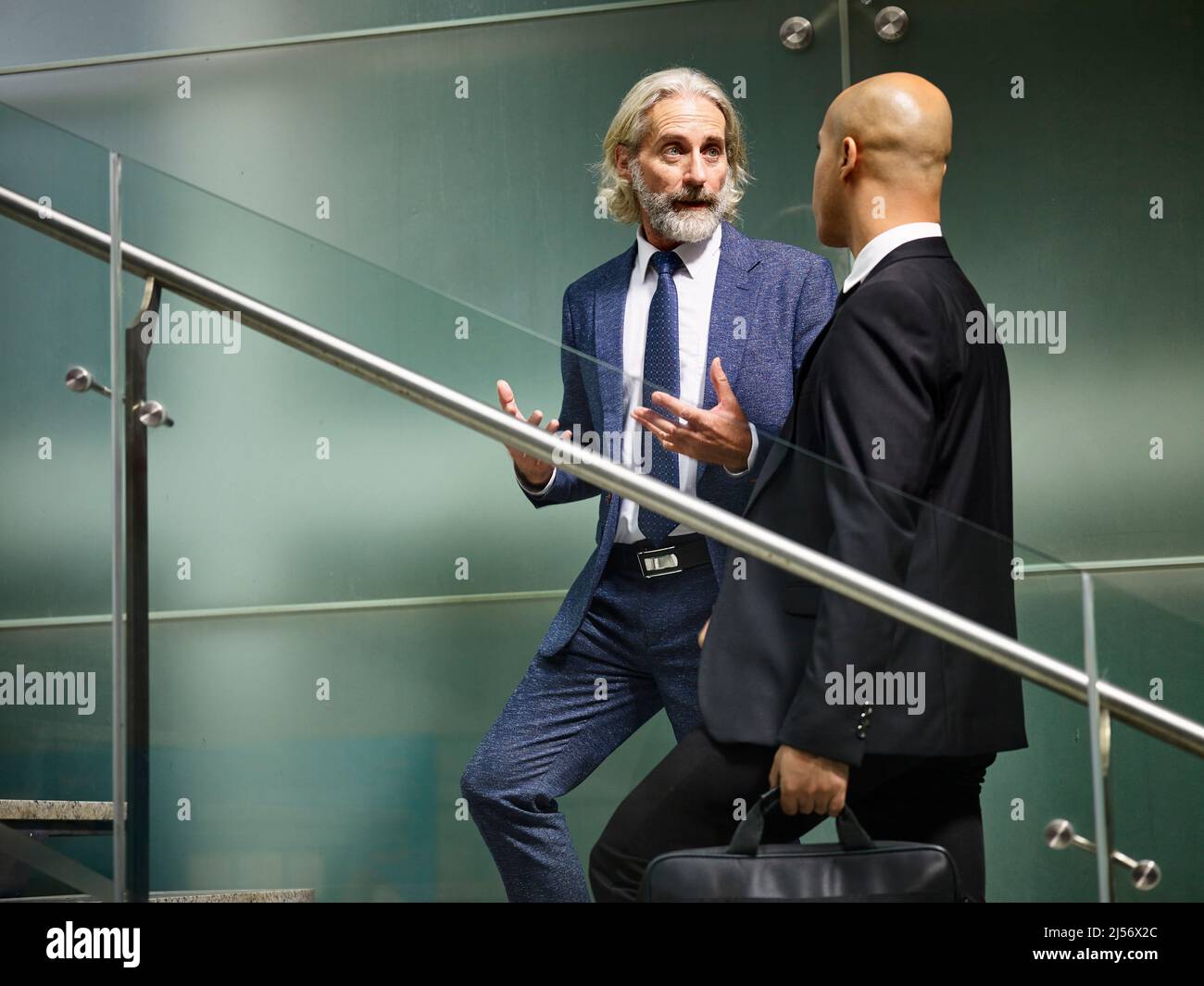 Business man walking stairs hi-res stock photography and images - Alamy