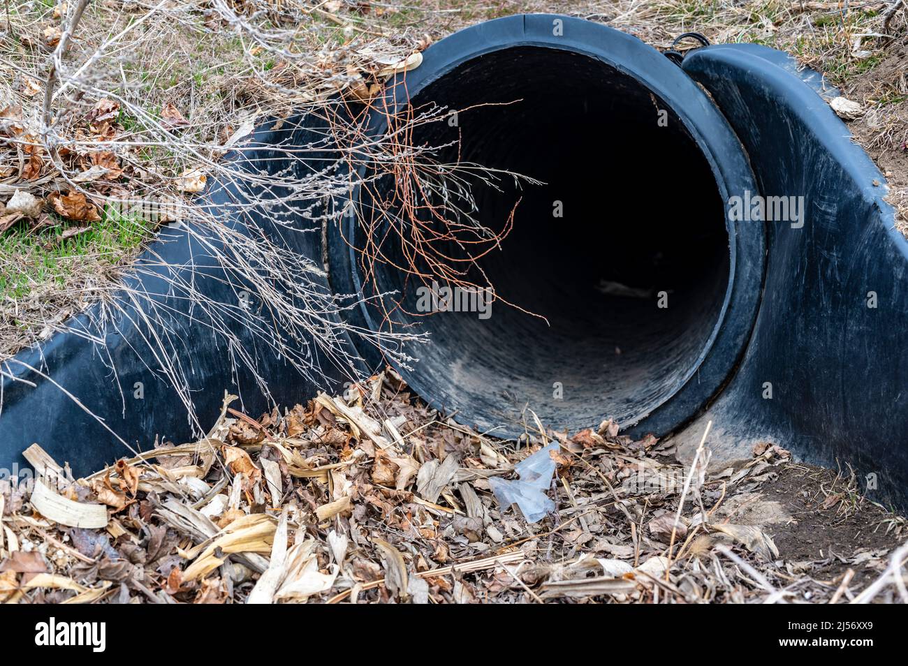 HDPE drainage culvert under a road entrance. Pipe is used to convey ...