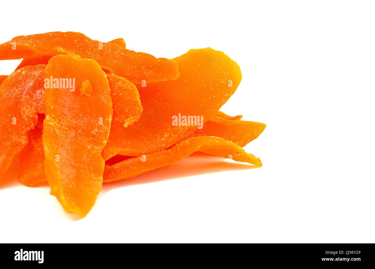 Candied Mango Strips on a White Background Stock Photo - Alamy