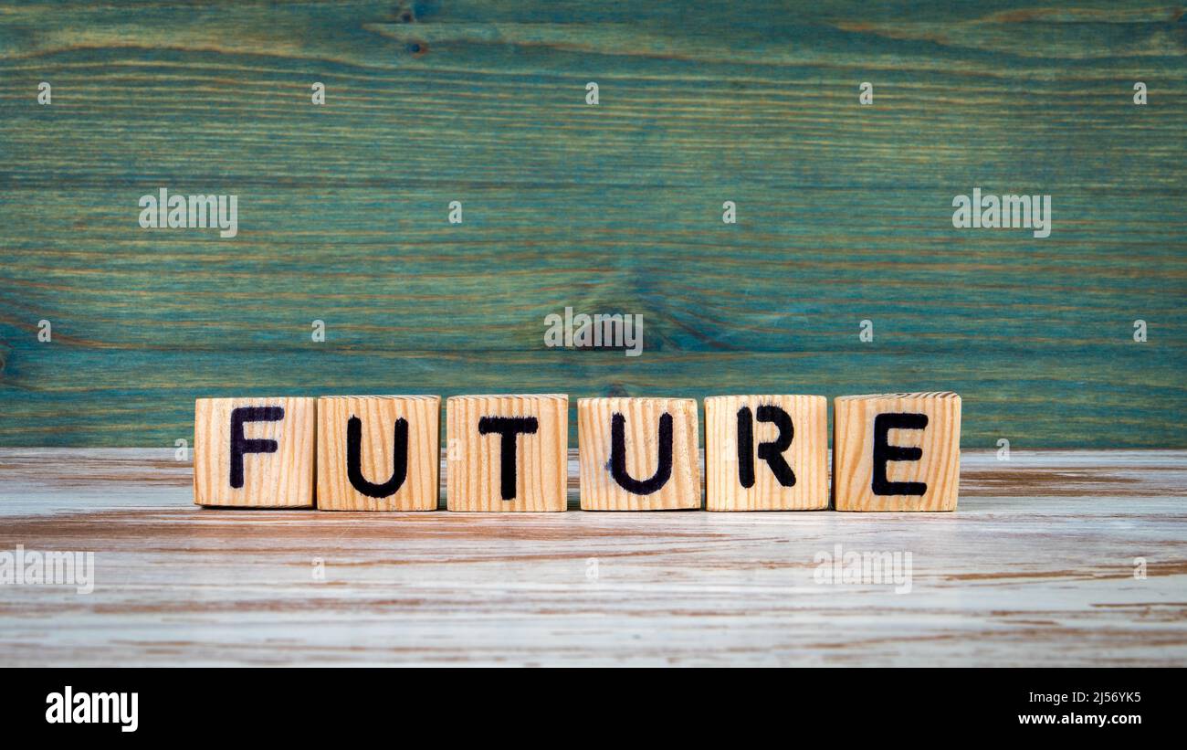 FUTURE. Word from alphabet blocks on a white and green wooden ...