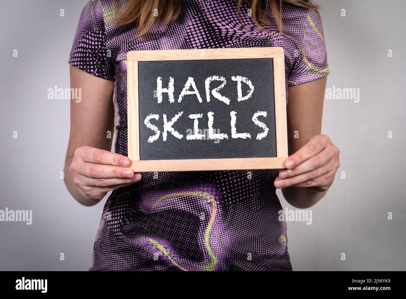 HARD SKILLS. Miniature chalk board with text in a woman's hands Stock ...