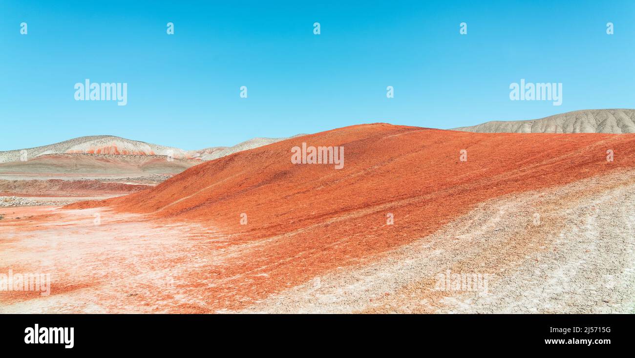 Red sand mountains in the desert area Stock Photo - Alamy