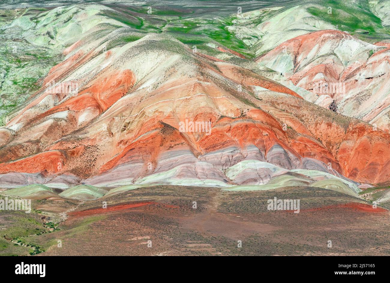 Red sand mountains in the desert area Stock Photo - Alamy