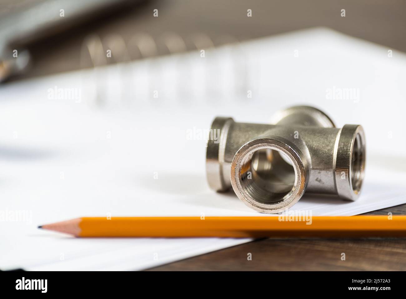 Plumbing pipeline element and adjustable wrench Stock Photo - Alamy
