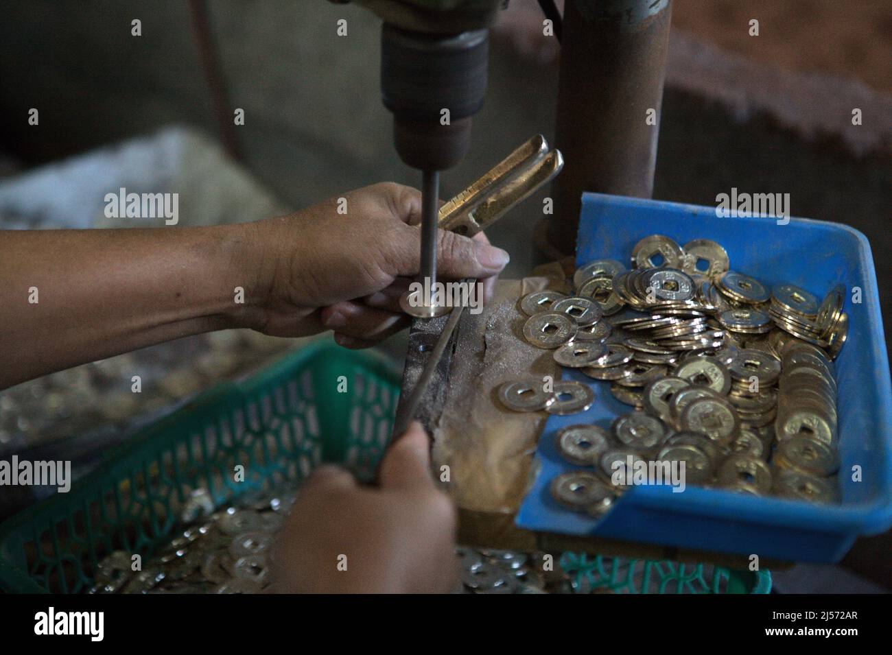 Production of traditional Balinese coins with hollow known as "pis ...