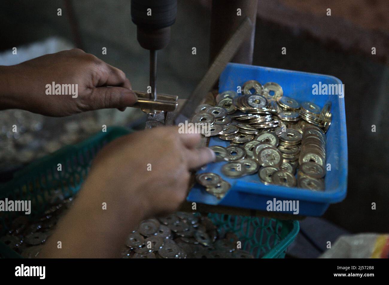 Production of traditional Balinese coins with hollow known as "pis ...